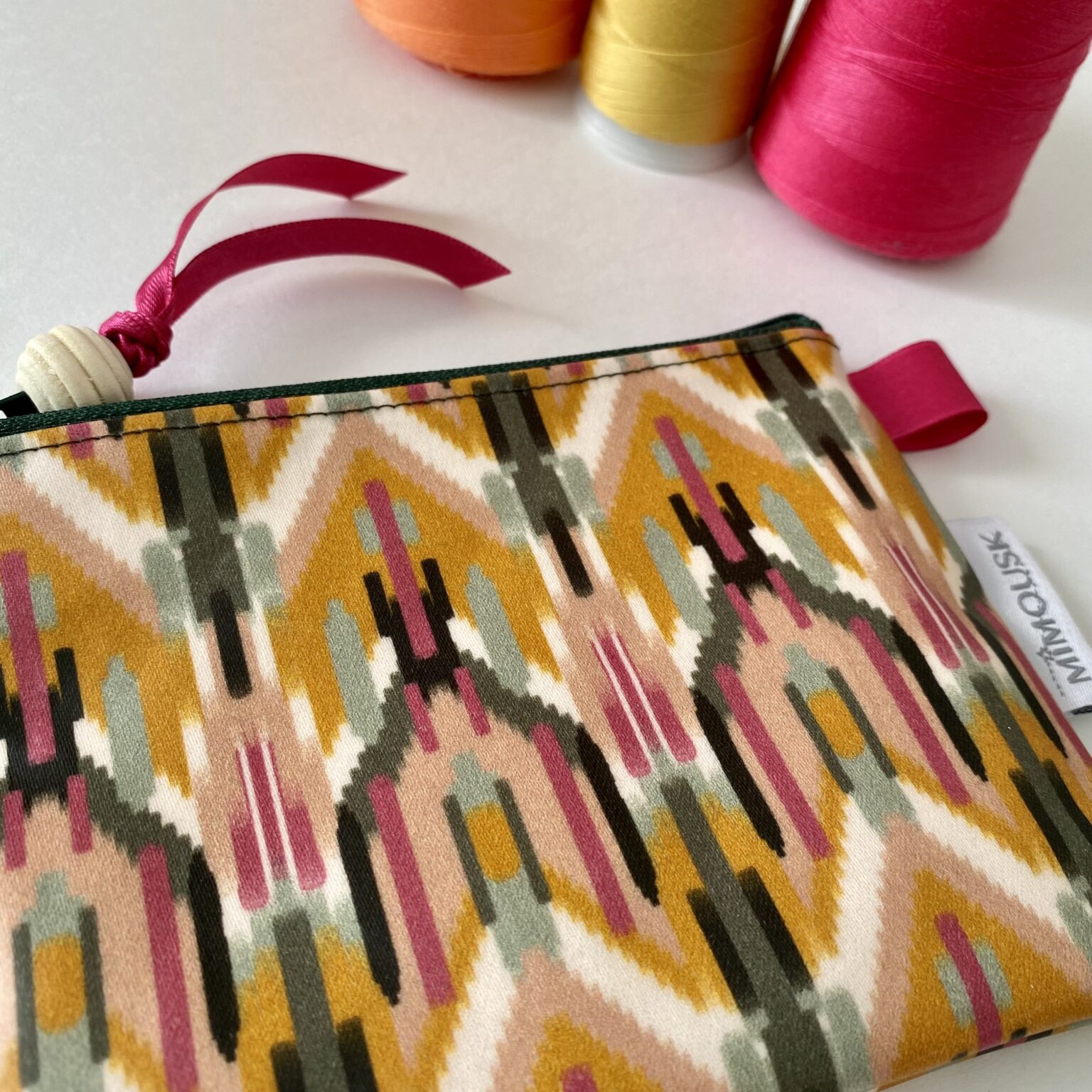 Trousse discrétion enduite / motif ikat, ocre rose kaki - Mimousk